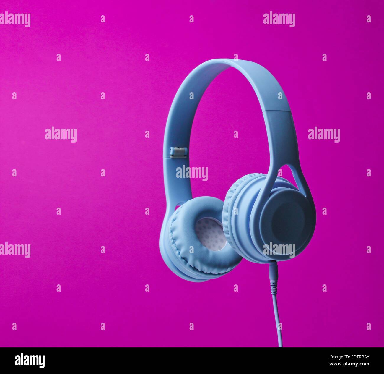 3D surround photo of modern headphones on pink background. Copy space ...