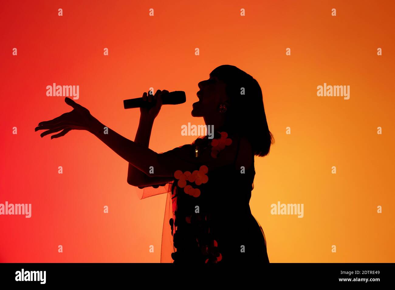 Female singer on stage silhouette hi-res stock photography and images ...