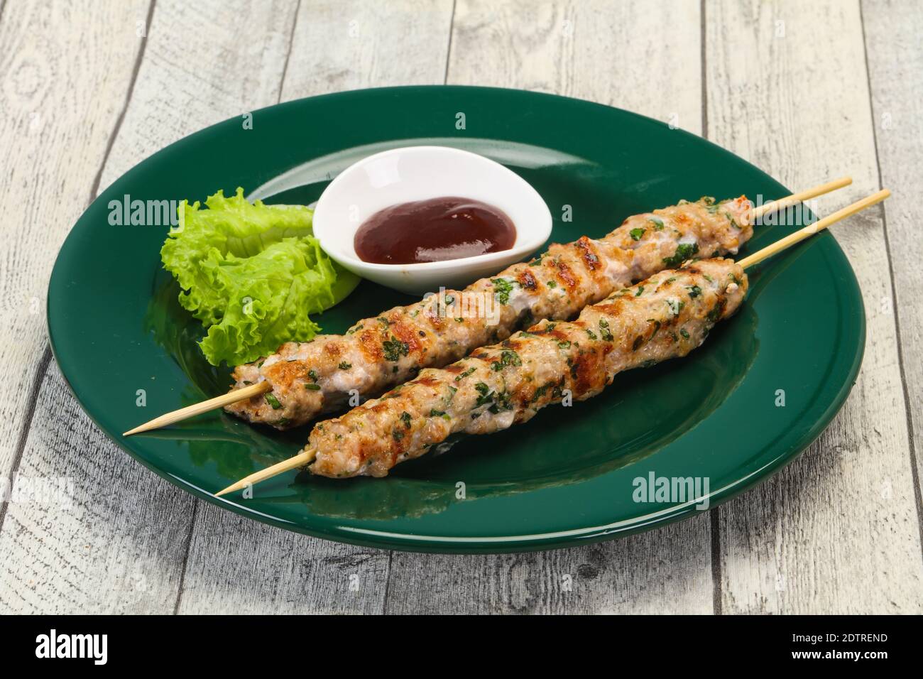 Minced pork skewer kebab with bbq sauce Stock Photo - Alamy