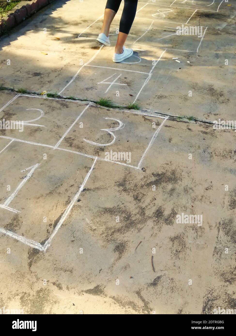 Woman hopscotch hi-res stock photography and images - Alamy