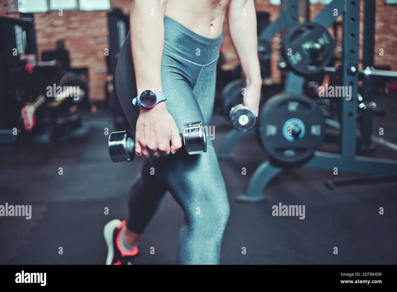 Training concept. Closeup of tense leg muscles in leggings Fitness ...