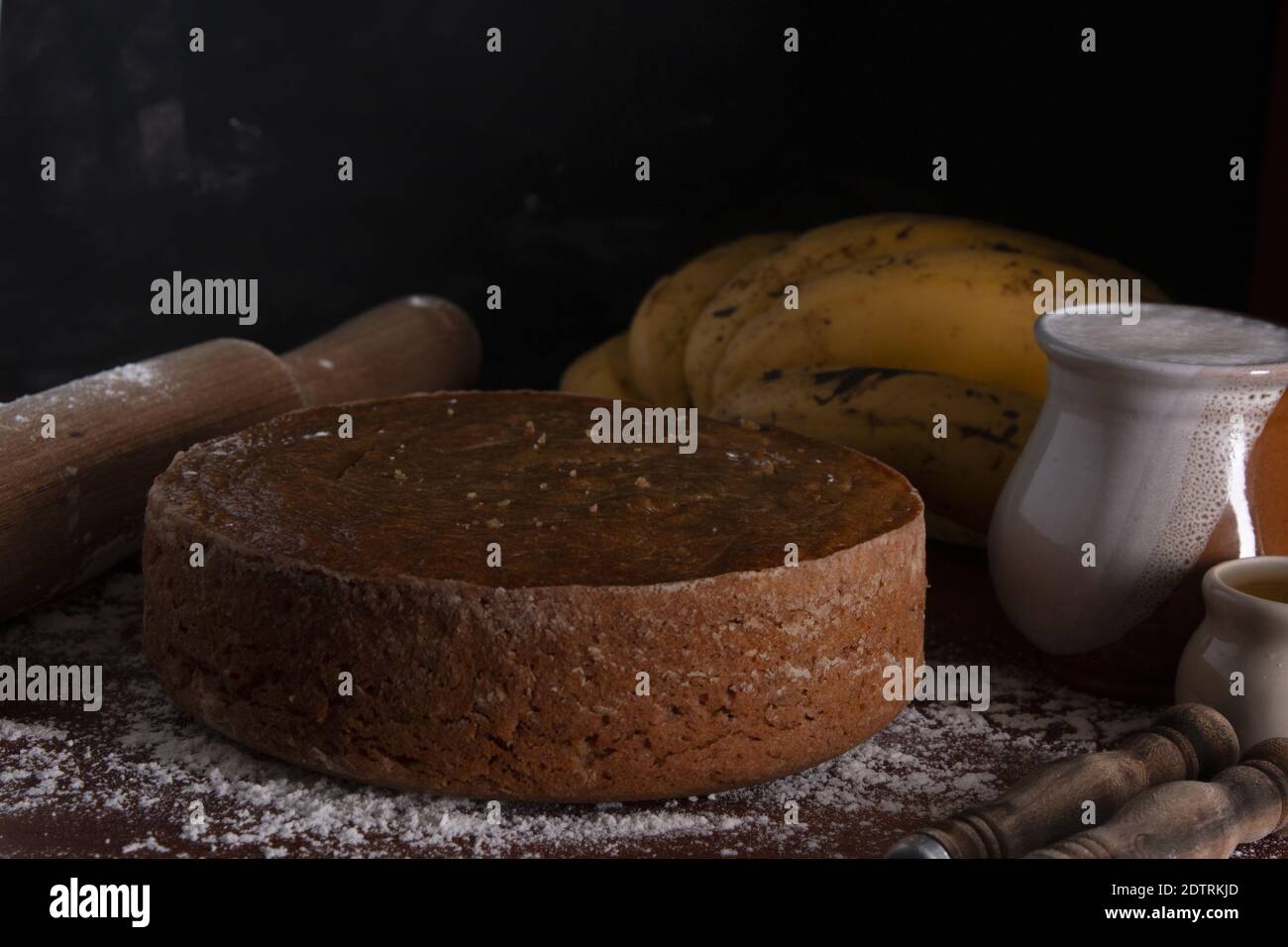 A homemade baked round banana cake with sugar powder Stock Photo - Alamy