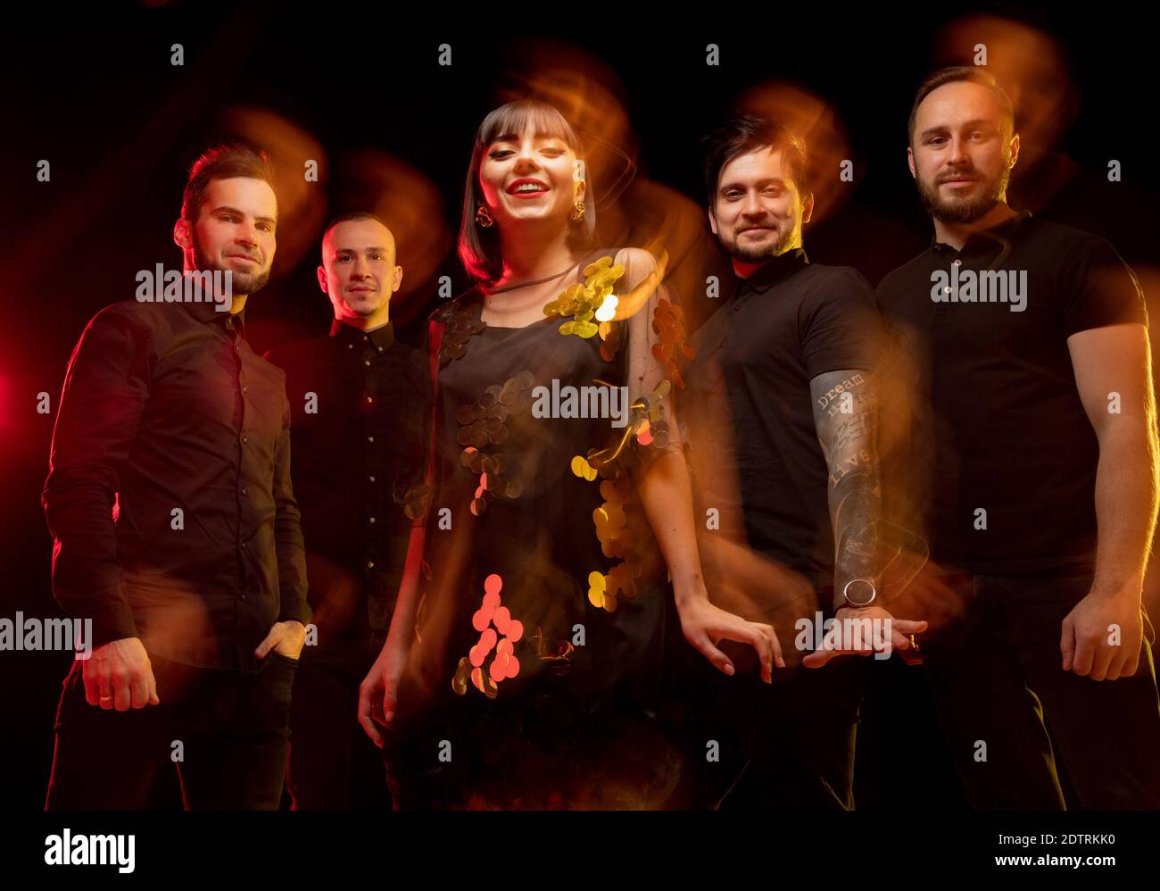 Mixed. Musician's band portrait isolated on dark studio background in ...