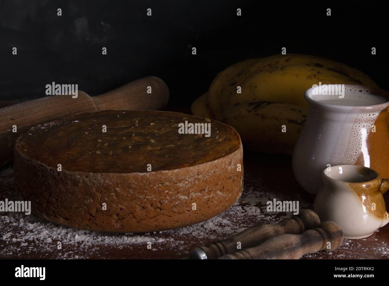 A homemade baked round banana cake with sugar powder Stock Photo - Alamy