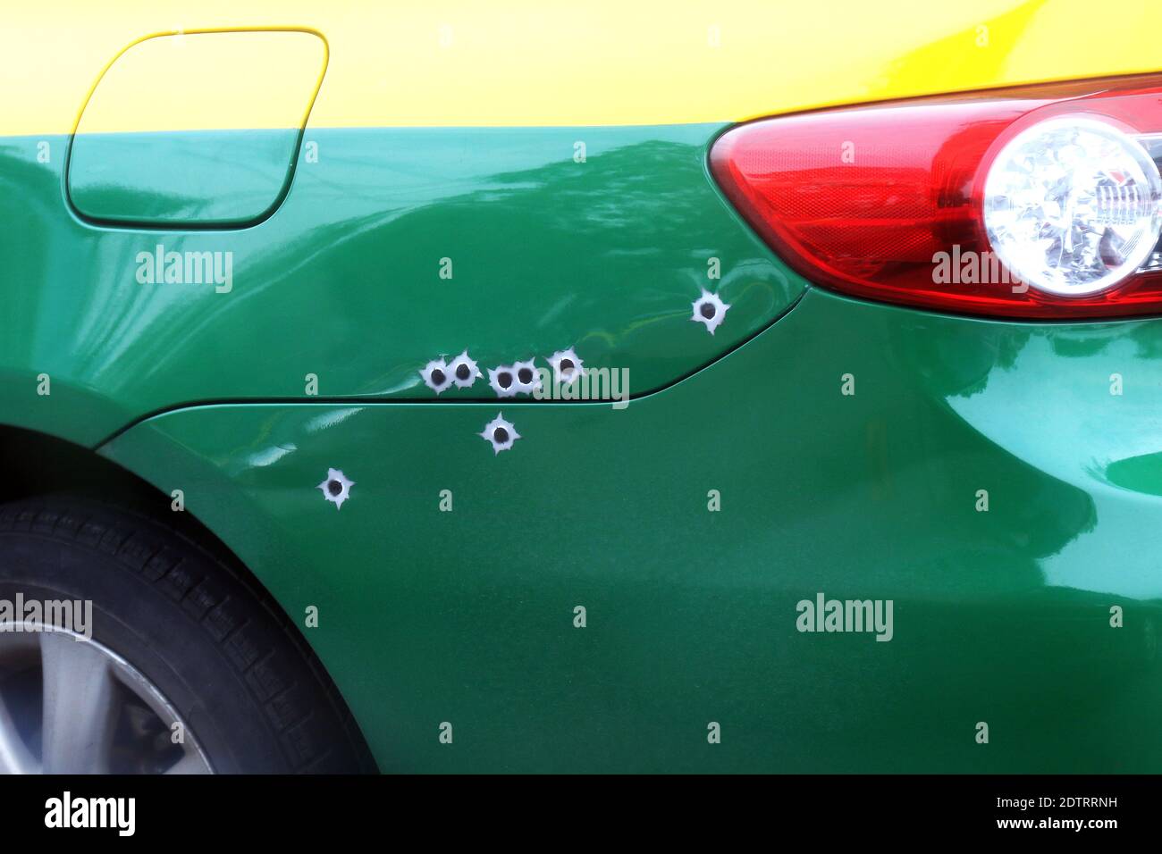 Bullet hole red car hi-res stock photography and images - Alamy