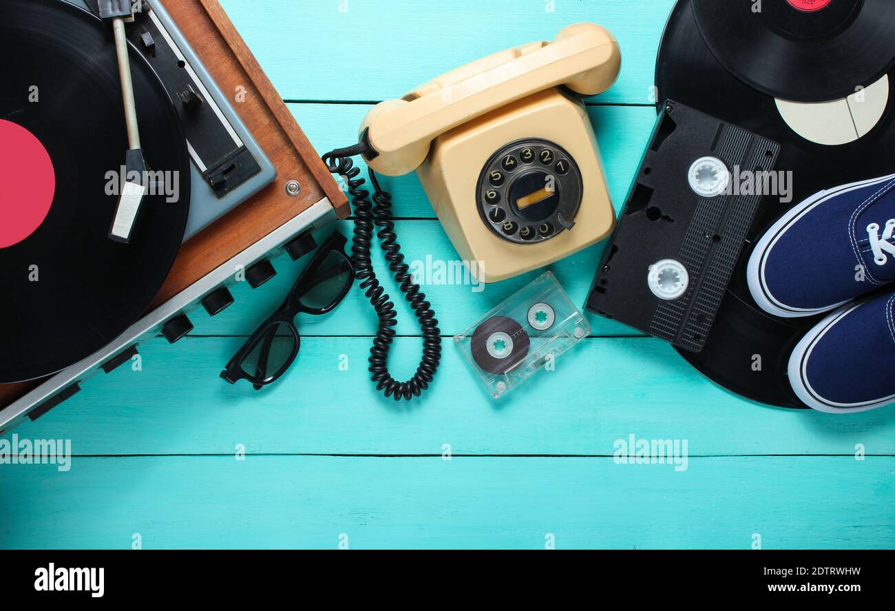 Old-fashioned objects on a blue wooden background. Retro style, 80s ...