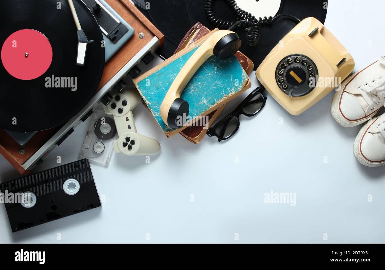 Retro 80s pop culture objects on white background. Copy space. Sneakers ...