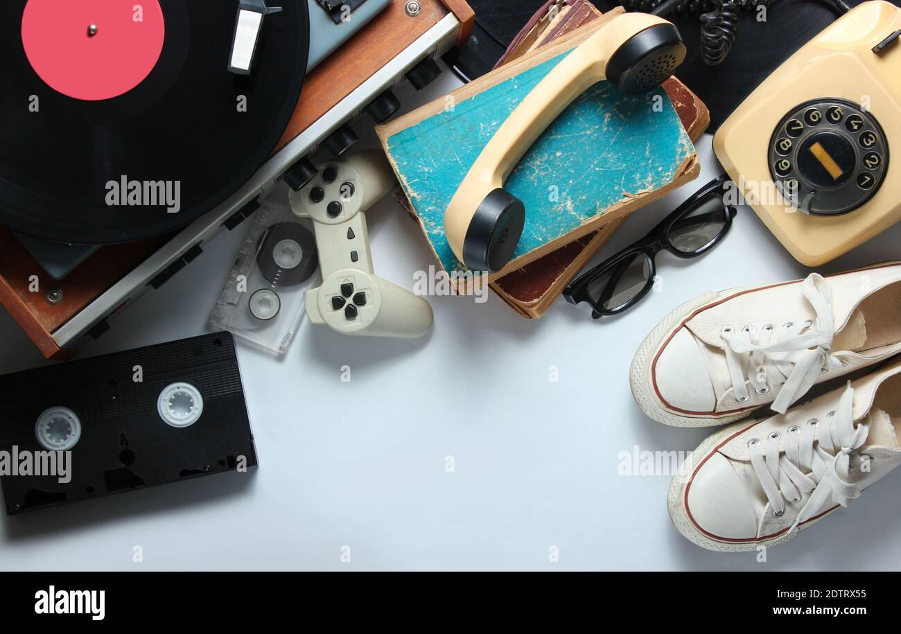 Retro 80s pop culture objects on white background. Copy space. Sneakers ...