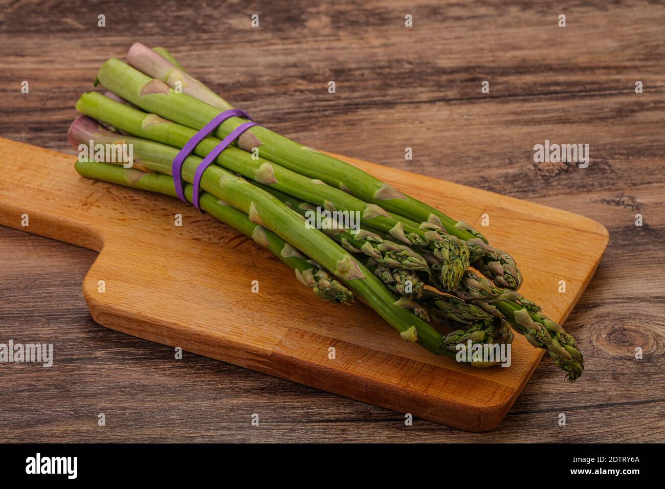 Vegan cuisine - Raw asparagus heap for cooking Stock Photo - Alamy