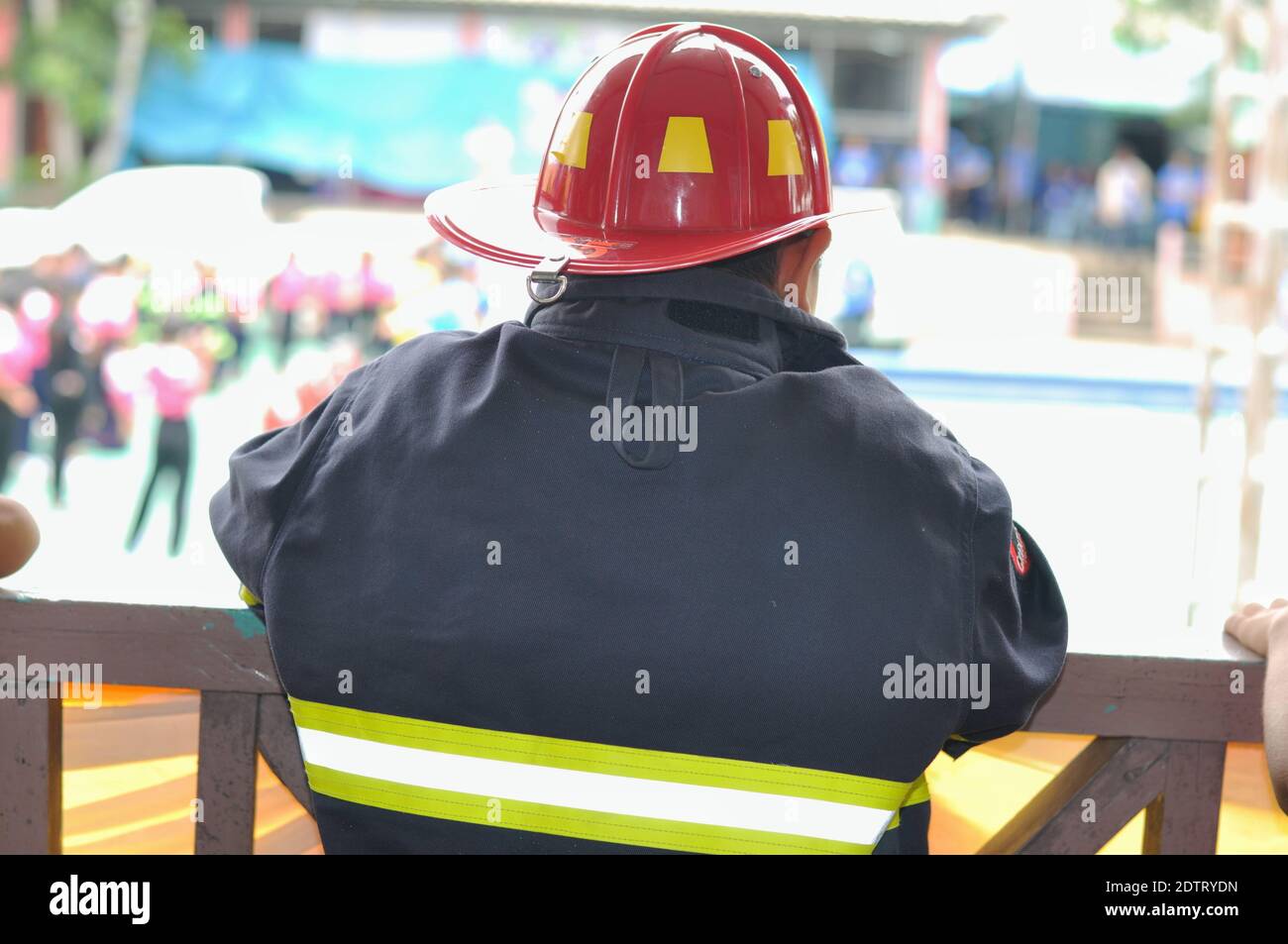 Rear View Of Firefighter Wearing Uniform Stock Photo - Alamy