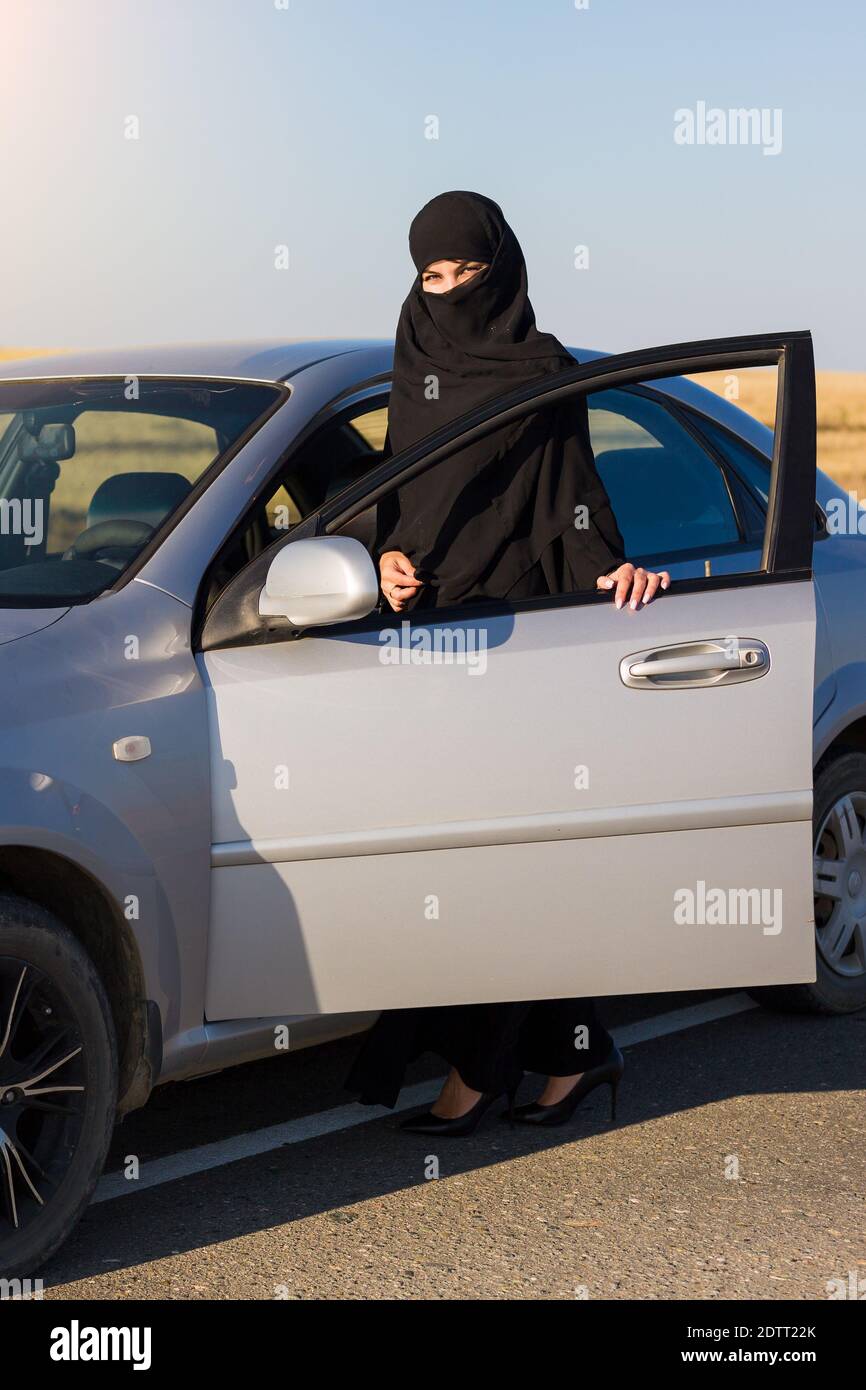 Muslim woman travel by car. Traditional clothing Stock Photo - Alamy