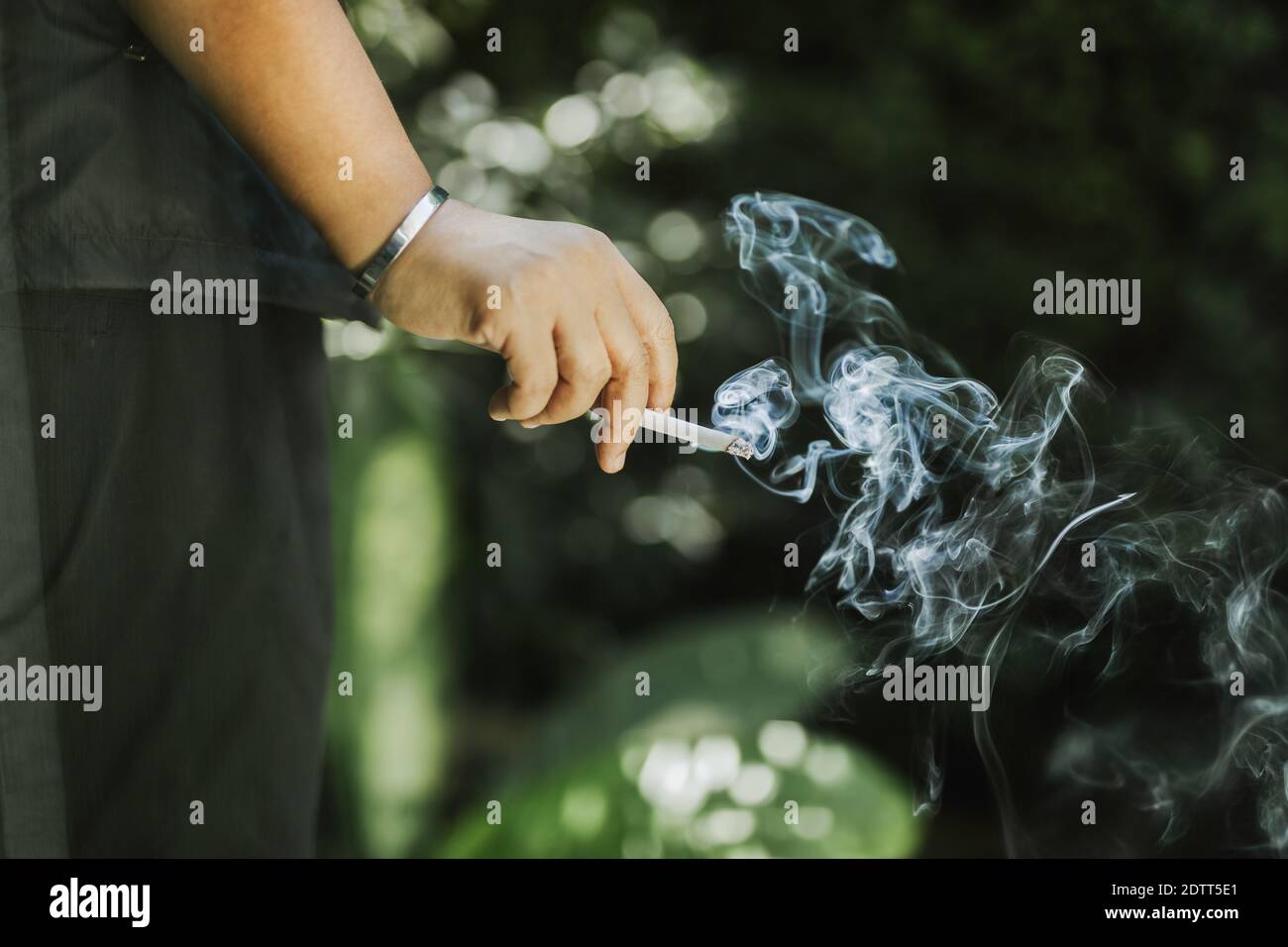 Gray man cigarette in dirty hi-res stock photography and images - Alamy