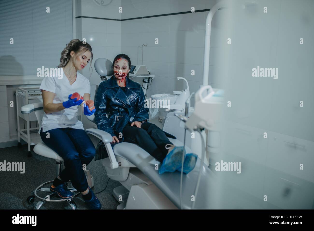 Woman in image of ugly bloody mutant treats her terrible teeth in ...