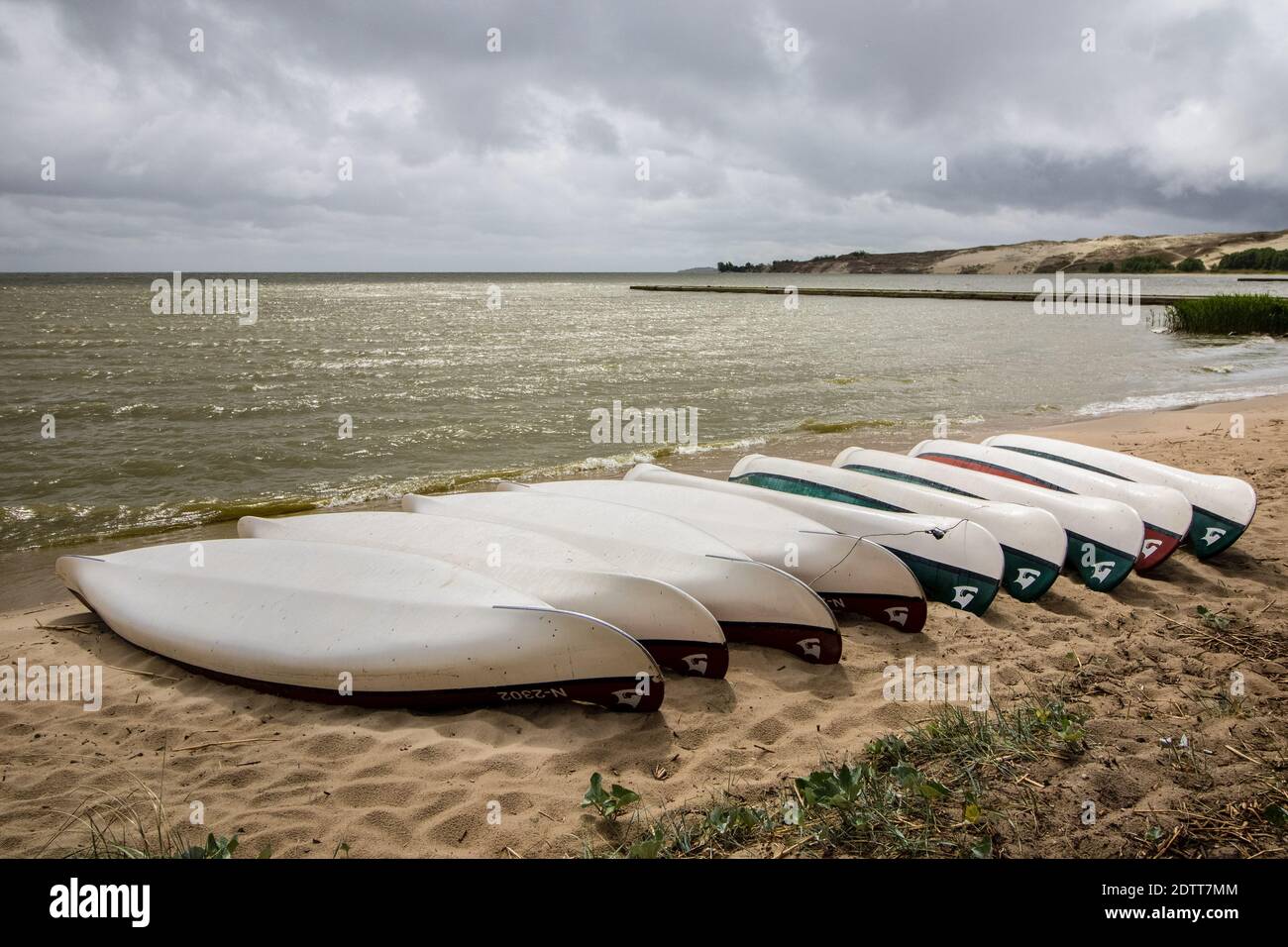 Bunch of kayaks on sandy beach of Nida, Baltic sea Stock Photo - Alamy
