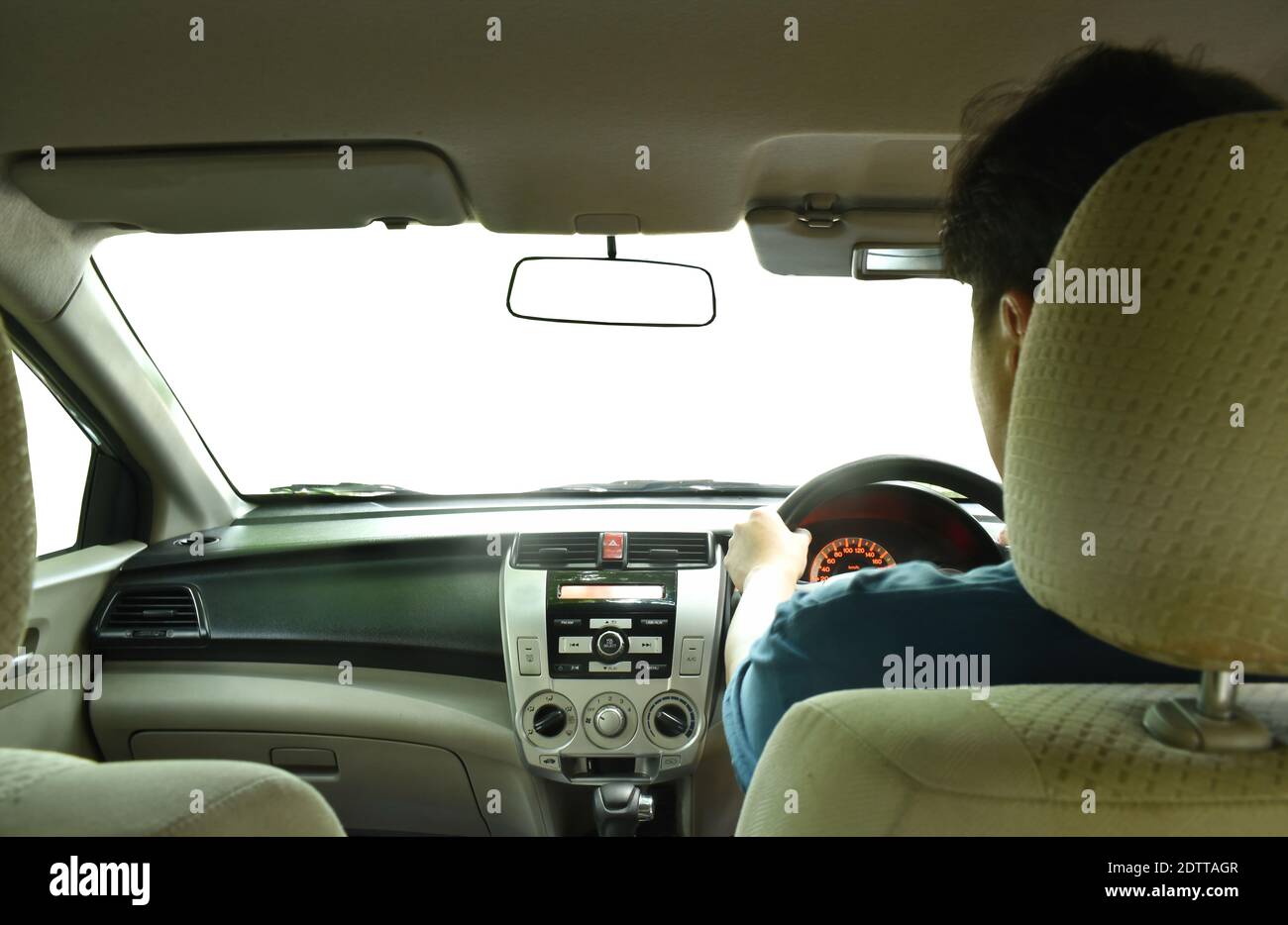 man driving in car cockpit with white windshield background Stock Photo ...