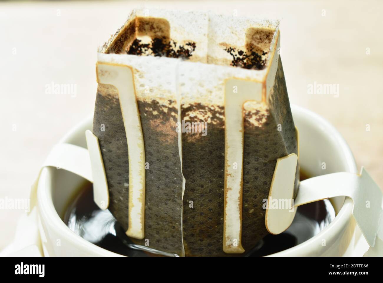 coffee drip mixed by hot water pouring from ceramic jar on cup Stock ...