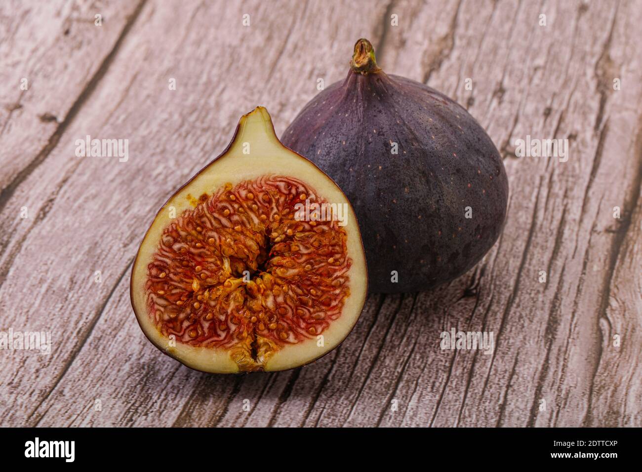 Sweet purple slice of fig fruit Stock Photo - Alamy