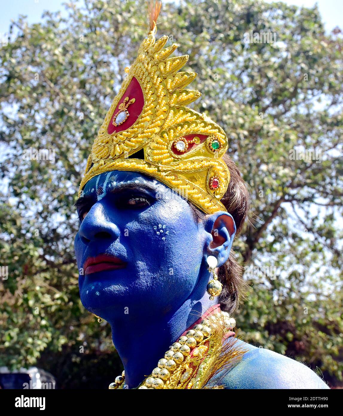 Artists perform as Lord Krishna before the procession starts on the eve ...