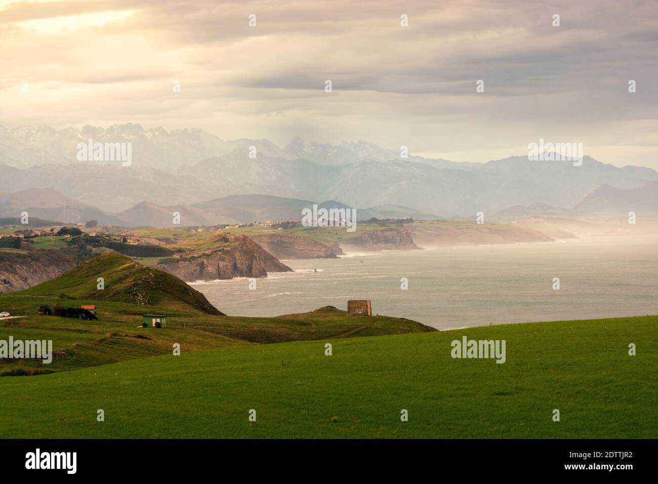 Huge green grass field and a cliff landscape with mountains on the ...