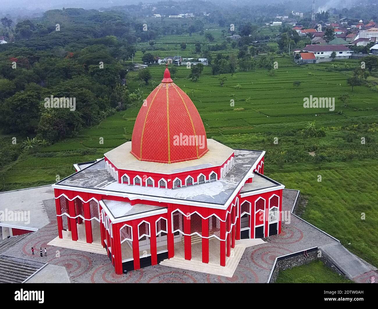 An aerial view of a red Masjid Merah mosque in Indonesia Stock Photo ...