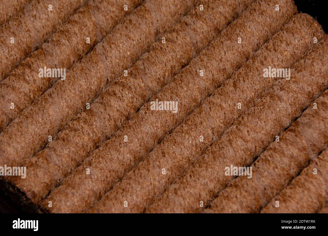 Many chocolate tasty wafer roll sticks Stock Photo - Alamy