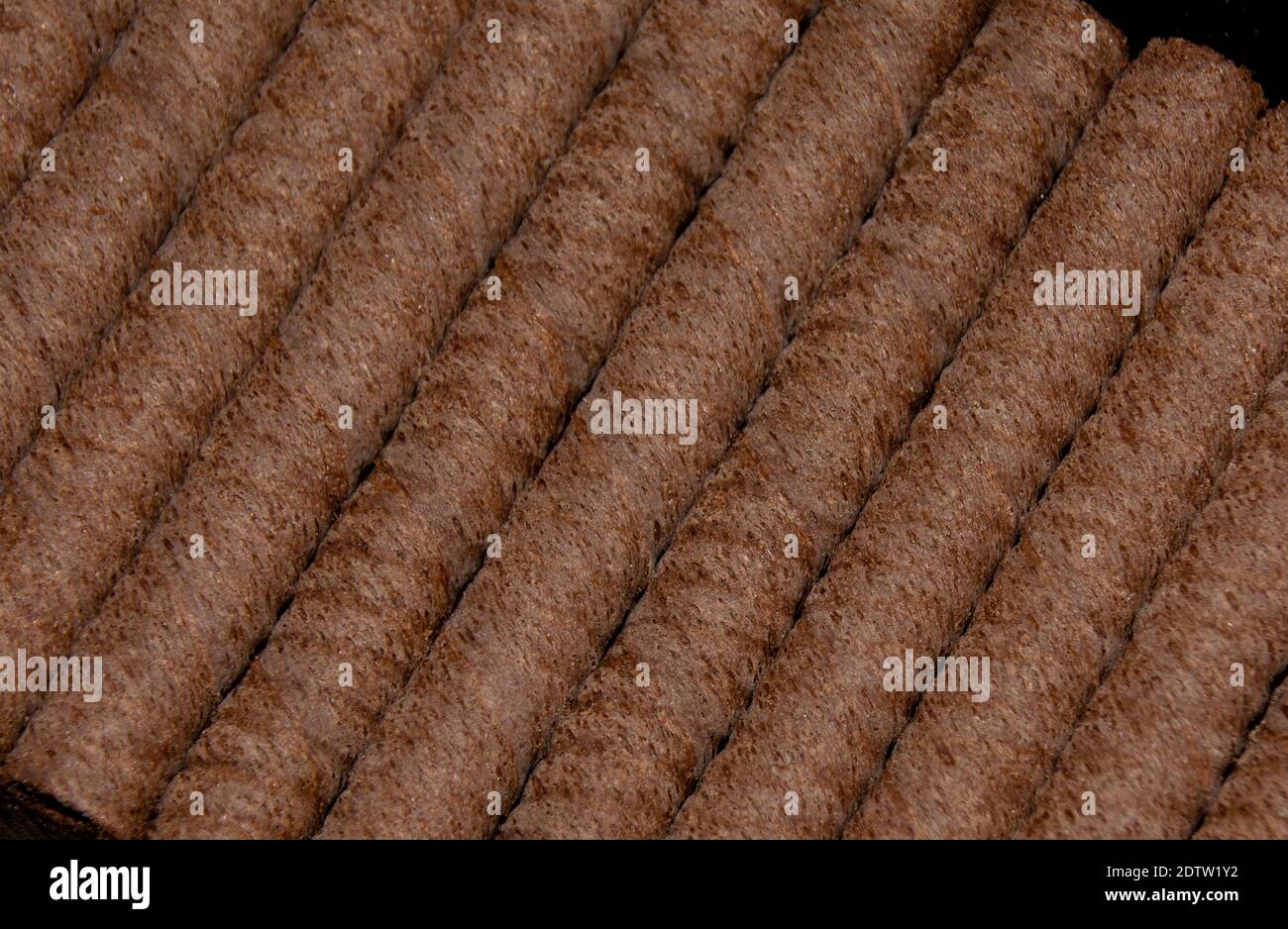 Many chocolate tasty wafer roll sticks Stock Photo - Alamy