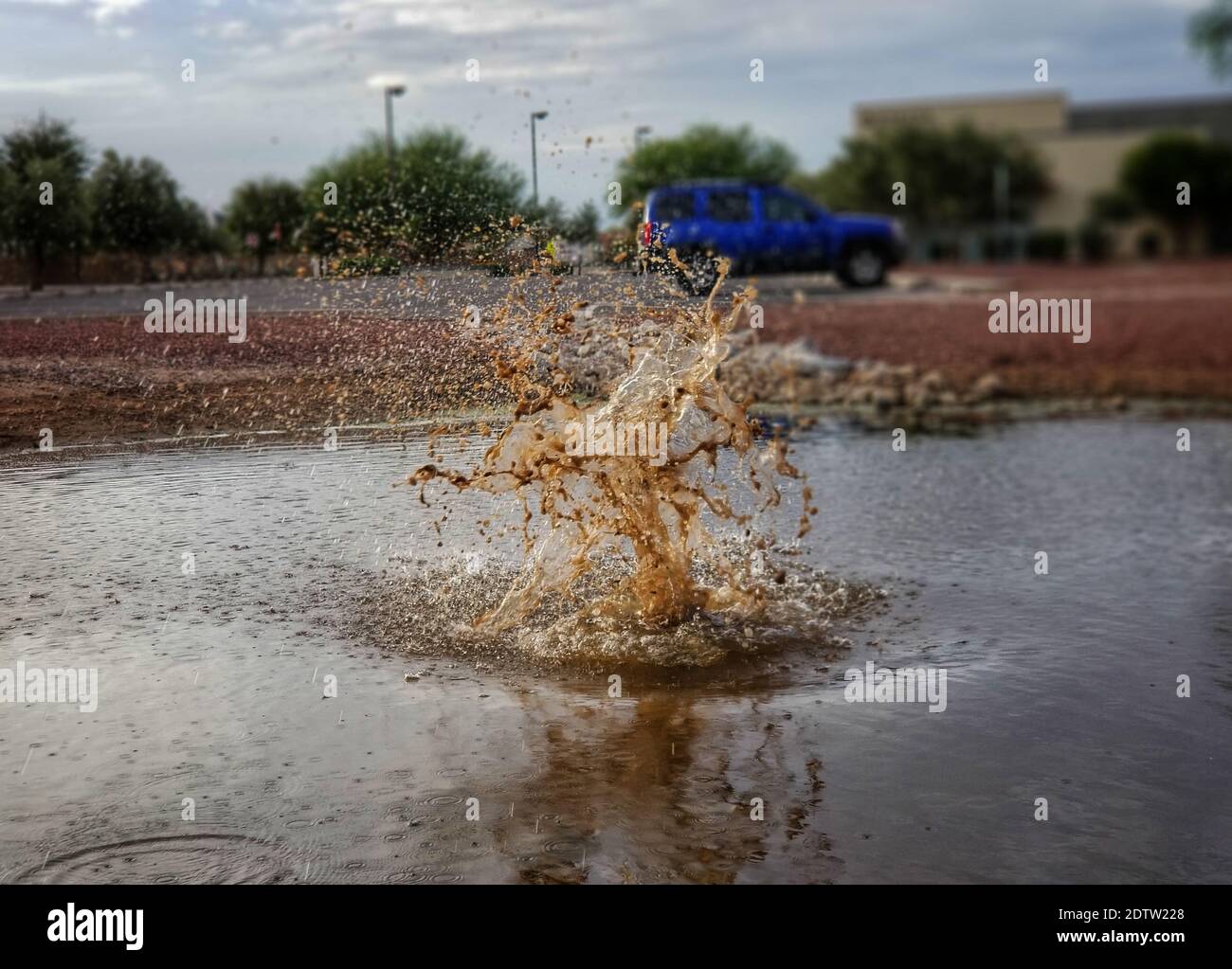 Droplet of water in puddle hi-res stock photography and images - Alamy