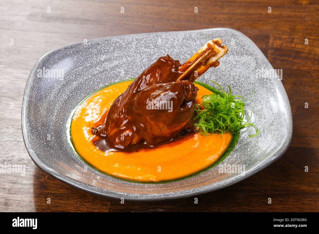 Lamb leg with cream sauce and spices Stock Photo - Alamy