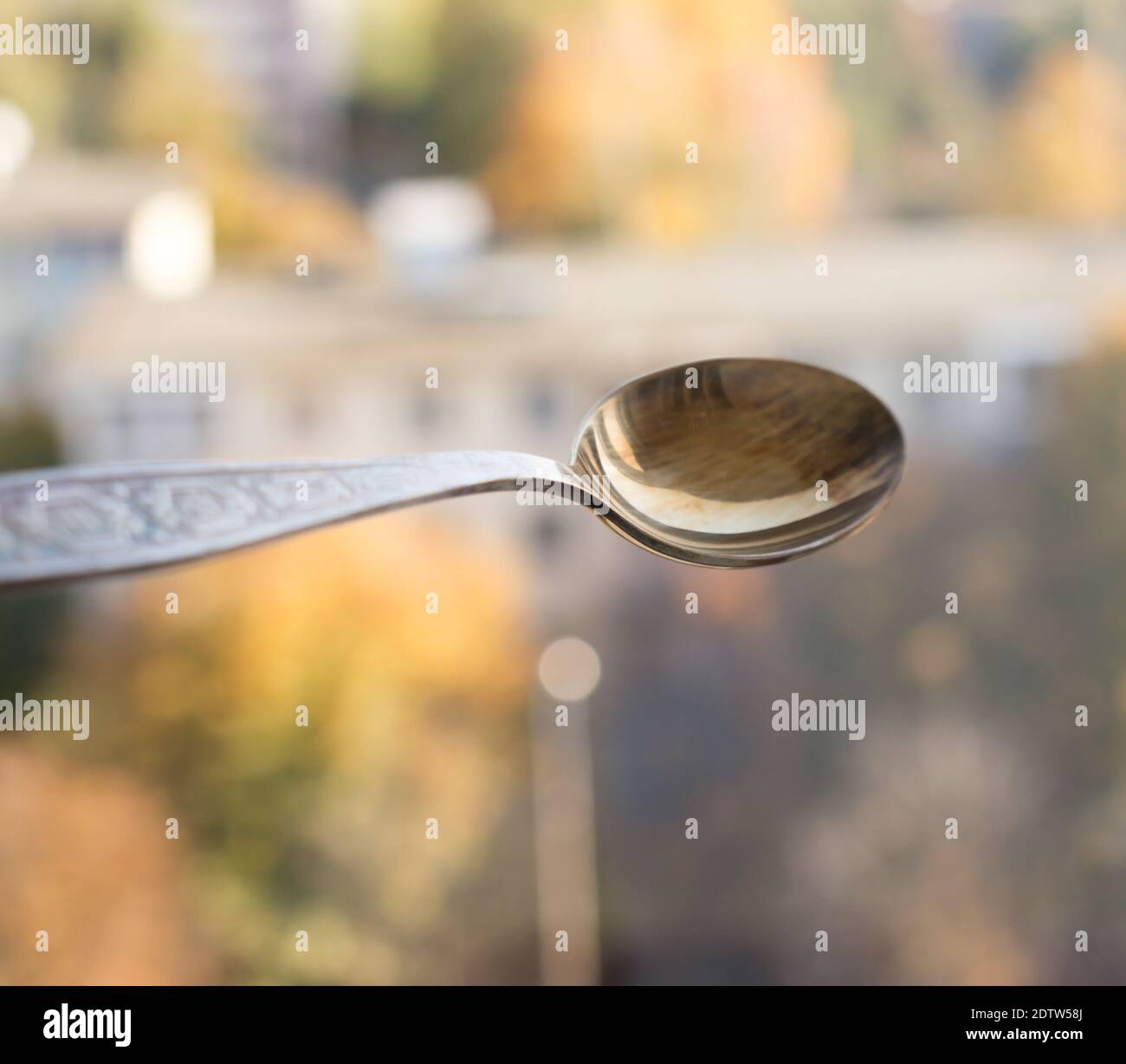 The cupronickel spoon object Stock Photo - Alamy