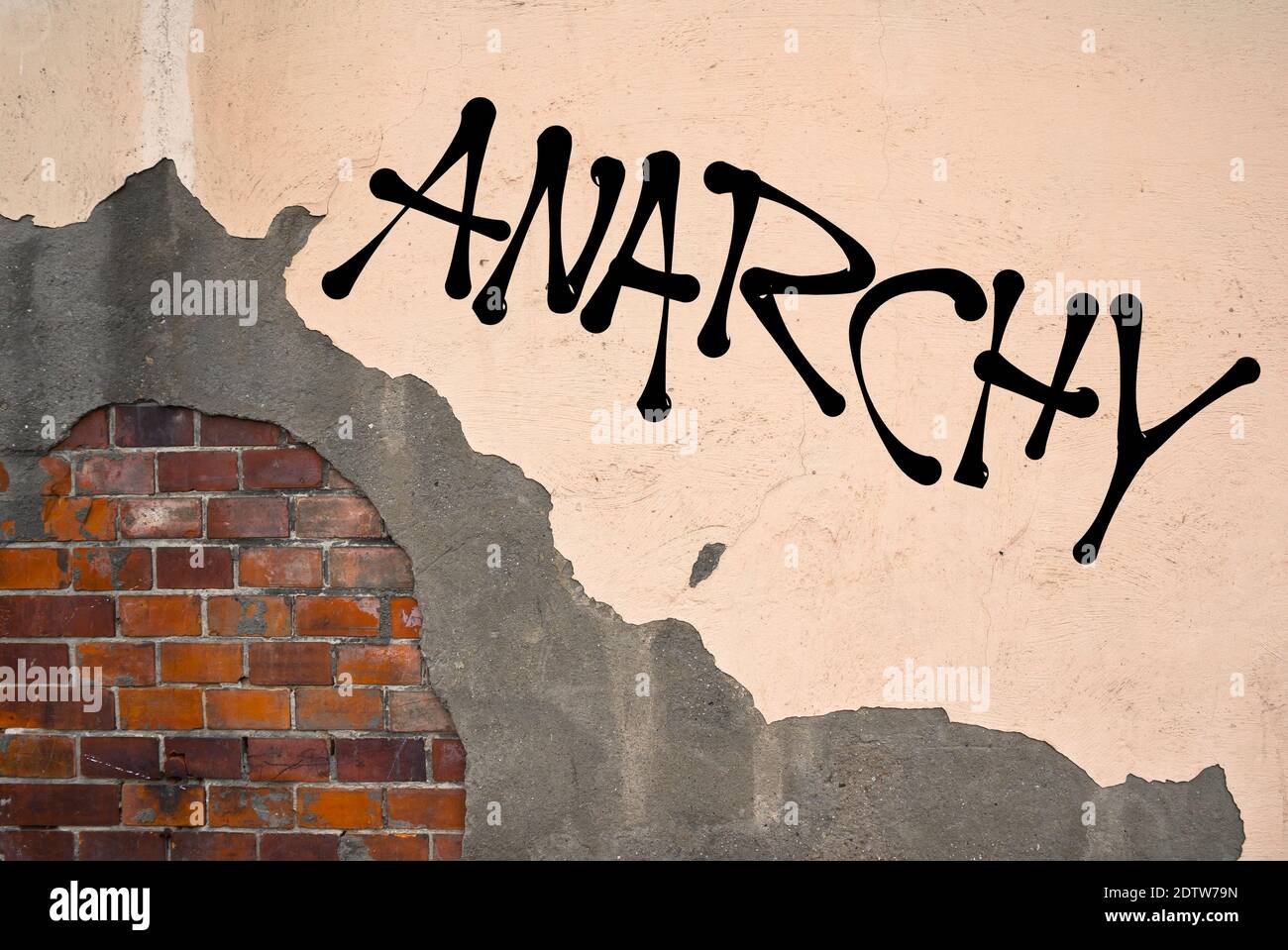 Handwritten graffiti Anarchy sprayed on the wall, anarchist aesthetics ...
