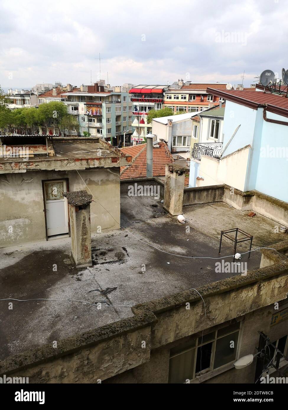 A vertical high angle shot of the roofs of the buildings of a ...