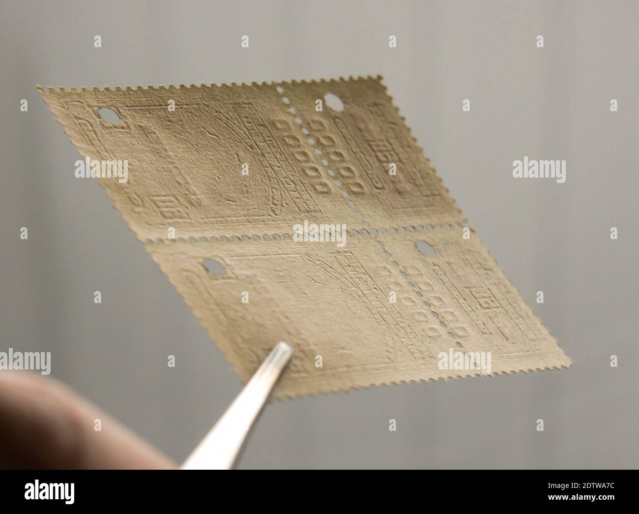 The reverse side of a postage stamp Stock Photo - Alamy