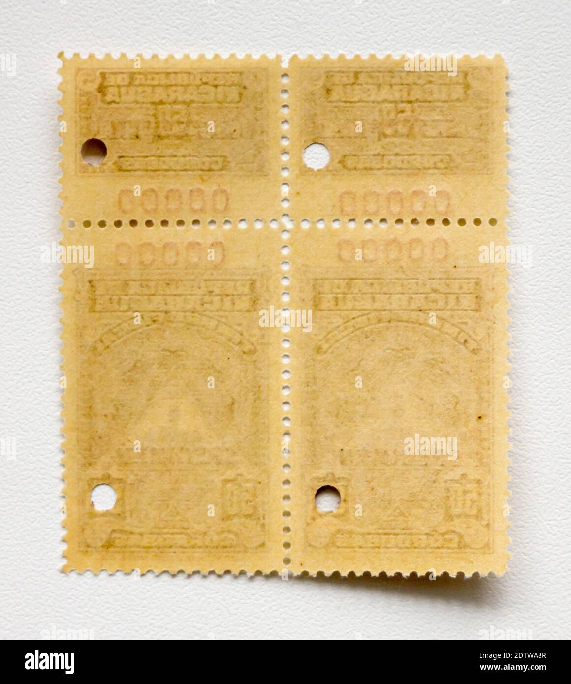 The reverse side of a postage stamp Stock Photo - Alamy