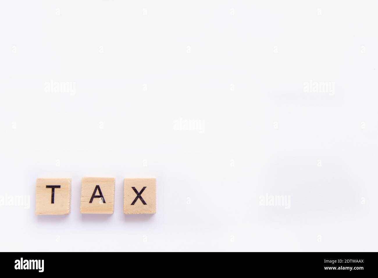 Tax Text On White Background Stock Photo - Alamy