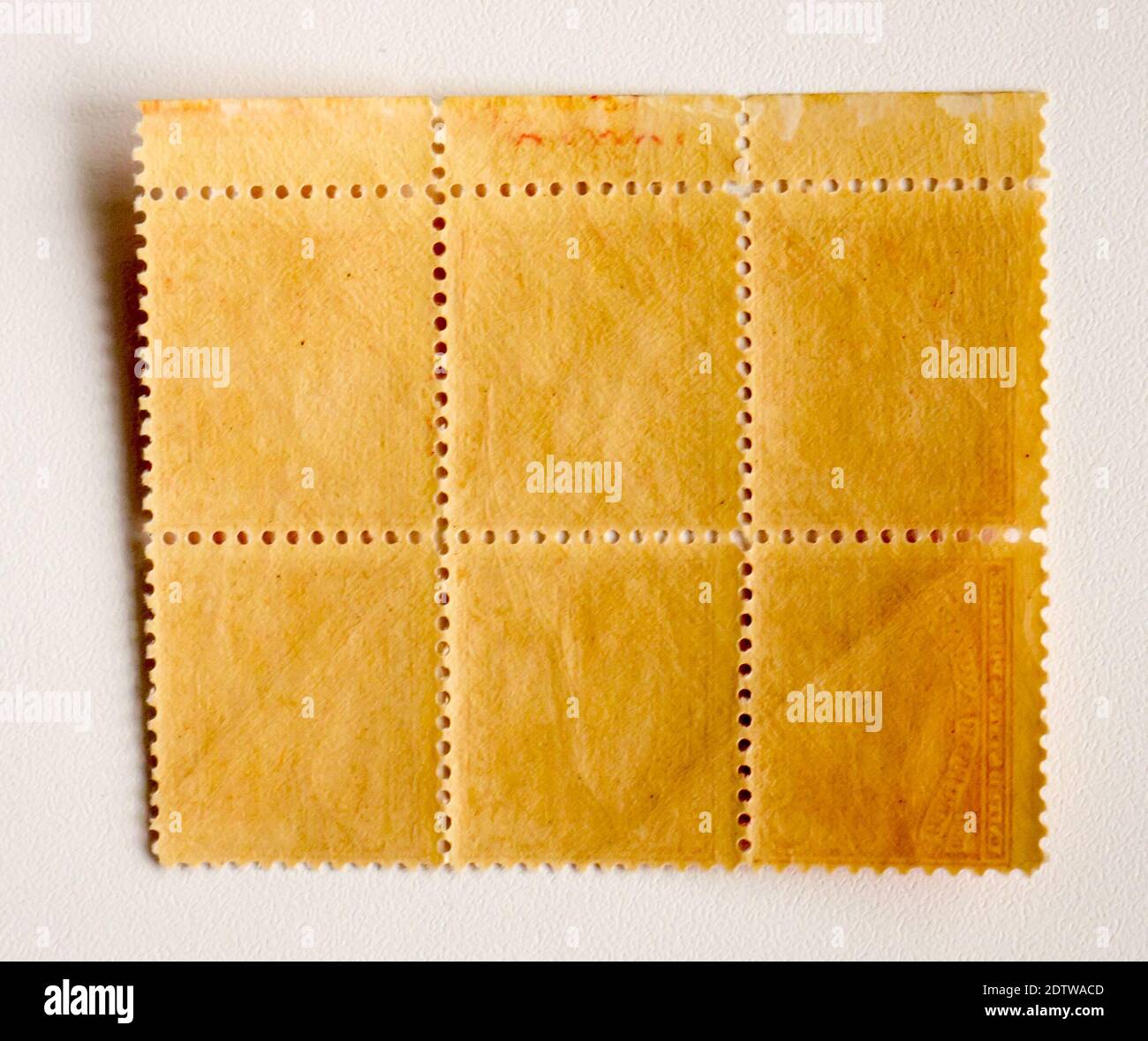 The reverse side of a postage stamp Stock Photo - Alamy