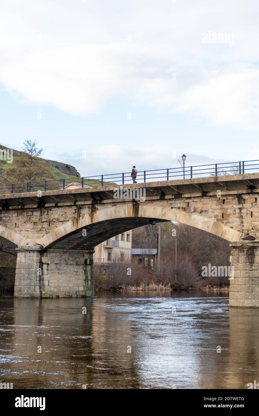 Stone bridge with people walking in a sunset Stock Photo - Alamy