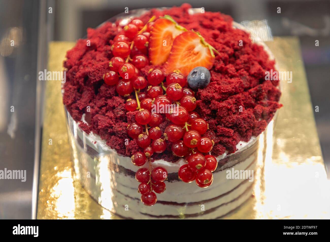 One Big Mix Red Berry Cake in Patisserie Stock Photo - Alamy