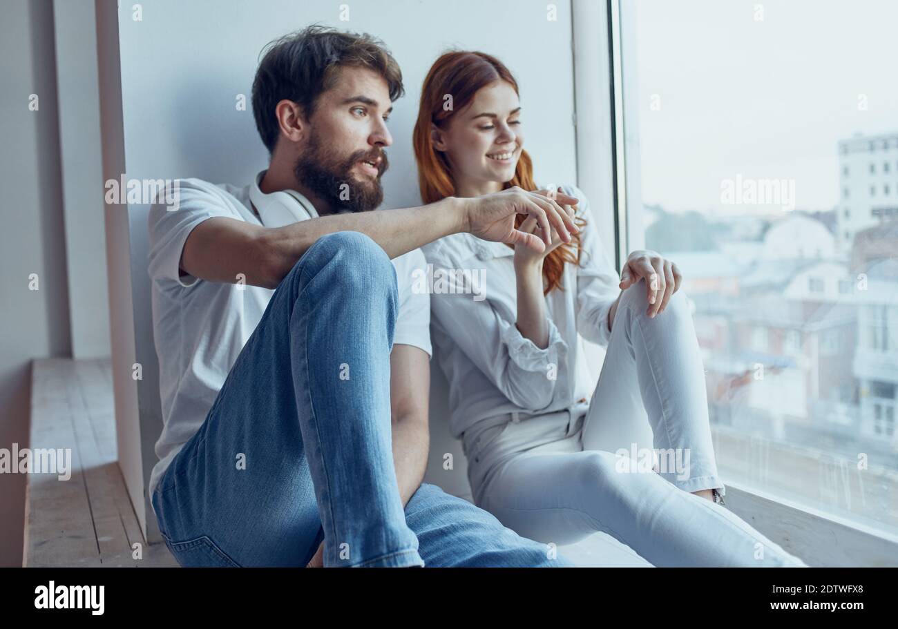 man and woman near the window rest interior fun lifestyle Stock Photo ...