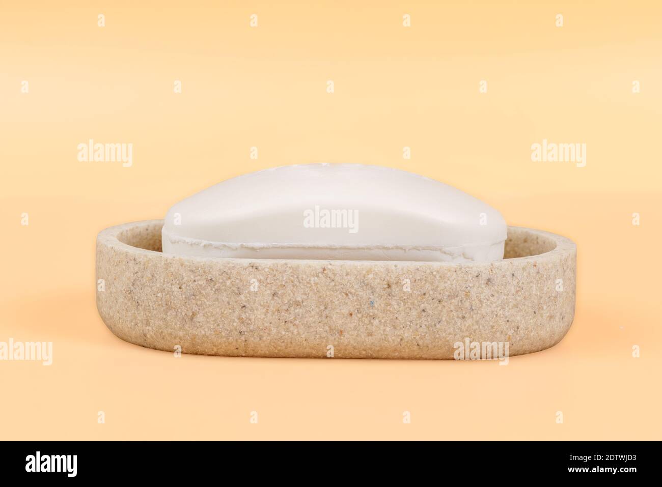 Soap in a soap dish close up. Side view isolated on beige, clipping ...