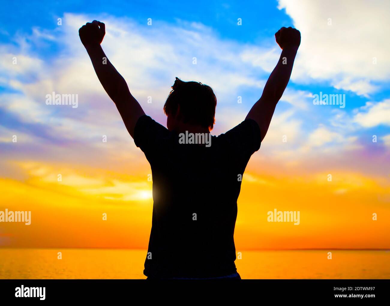 Happy Person Silhouette at the Sunset on the Sea Background Stock Photo ...