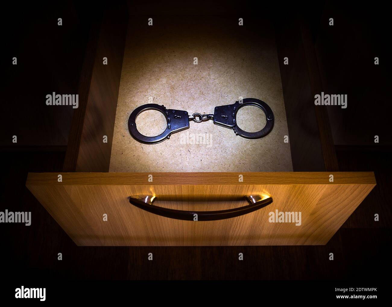 Handcuffs in the Opened Drawer of the Furniture in the Dark Room Stock ...