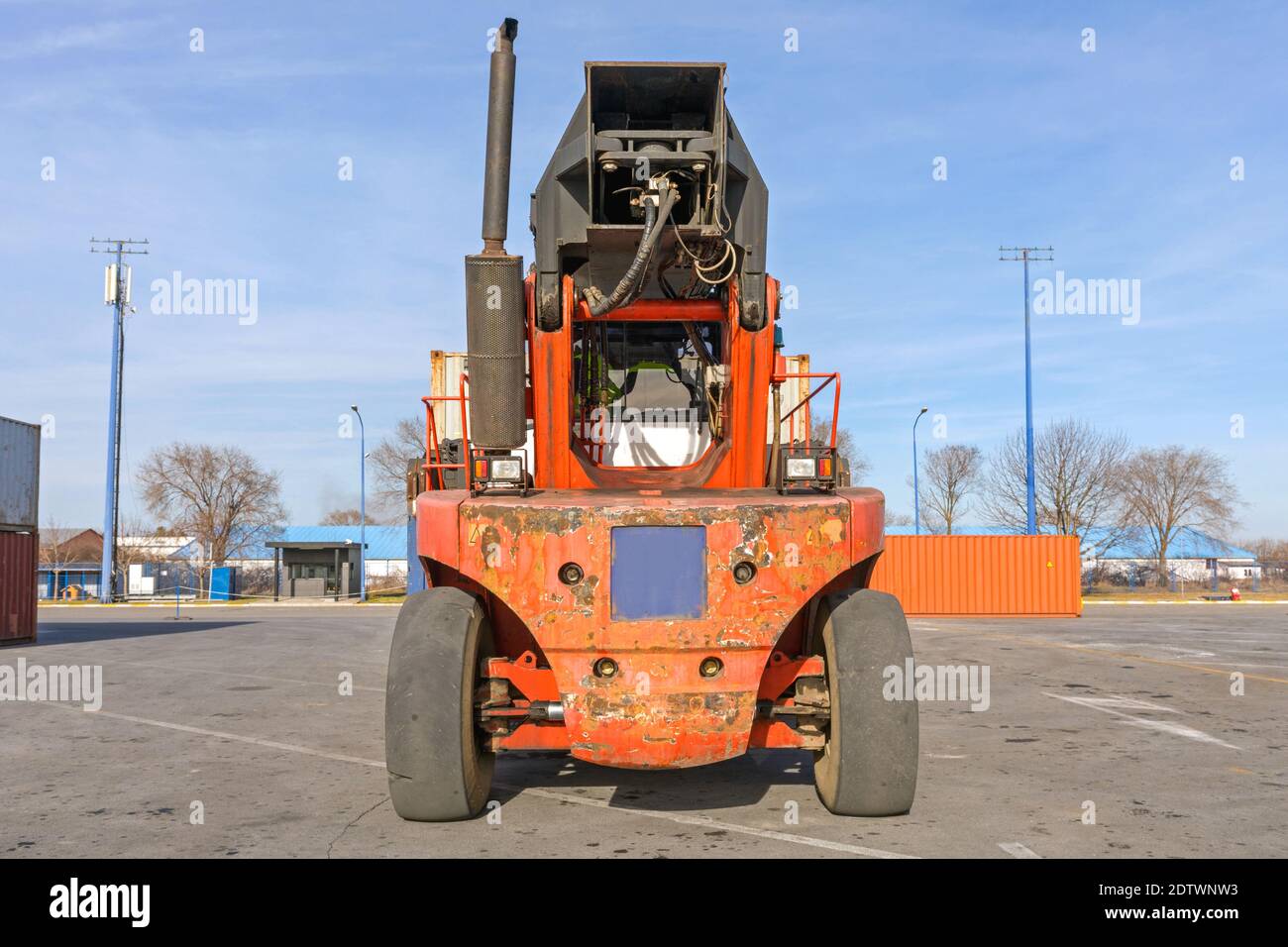 Reach Stacker Lifting Cargo Container at Terminal Yard Stock Photo - Alamy