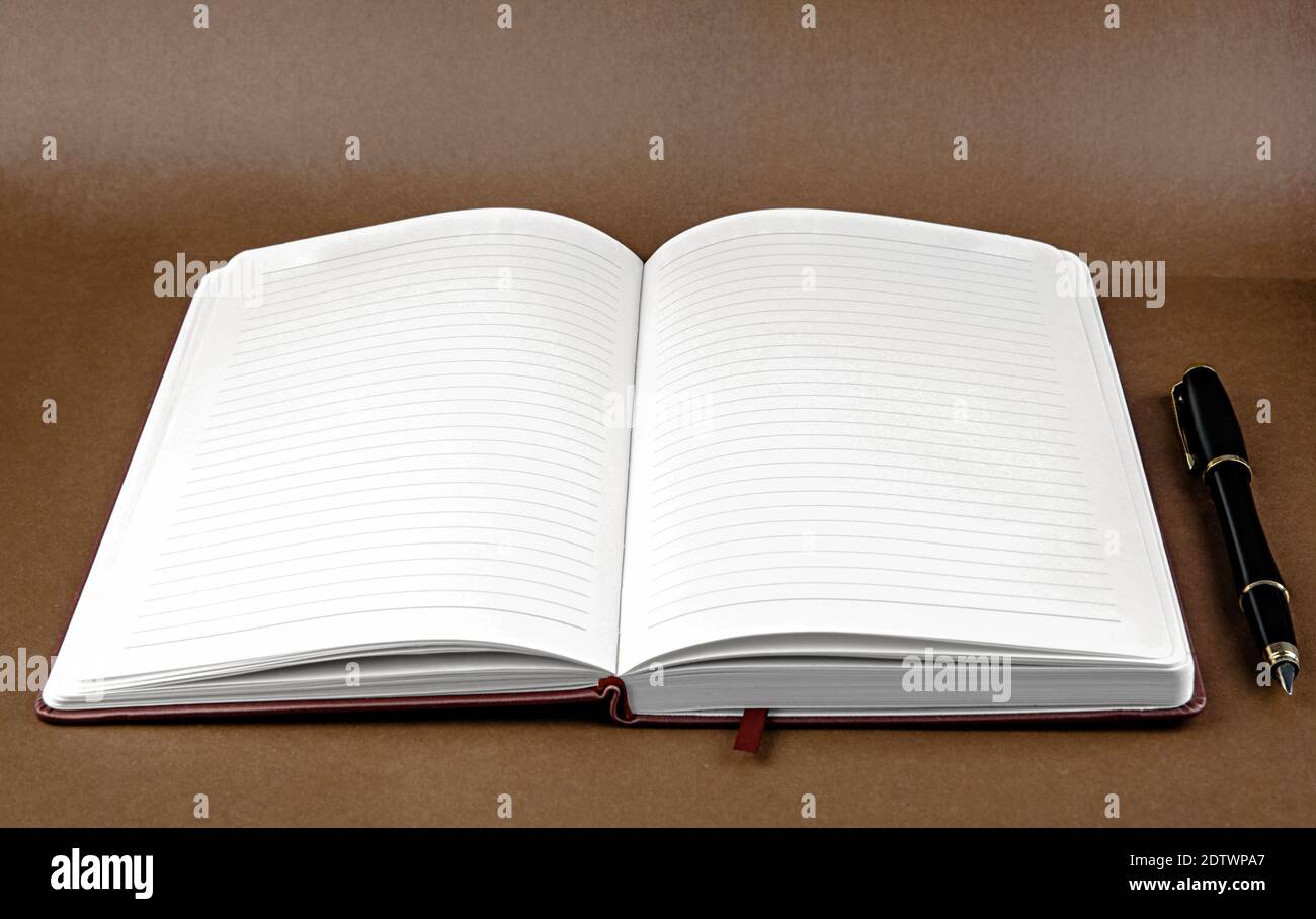 Blank Writing Pad on the Brown Paper Background closeup Stock Photo - Alamy