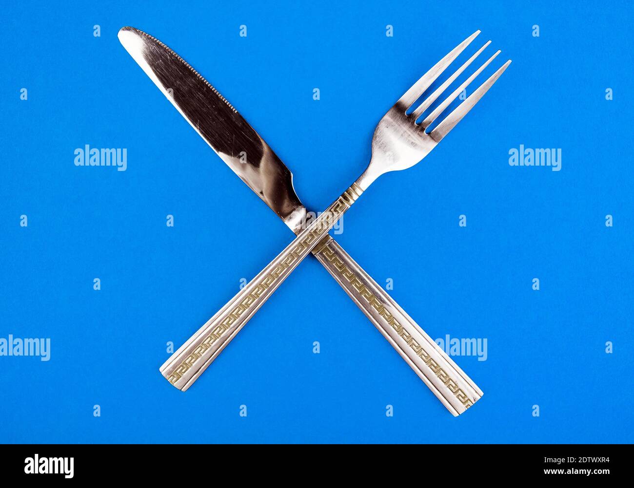 Cutlery on blue paper hi-res stock photography and images - Alamy