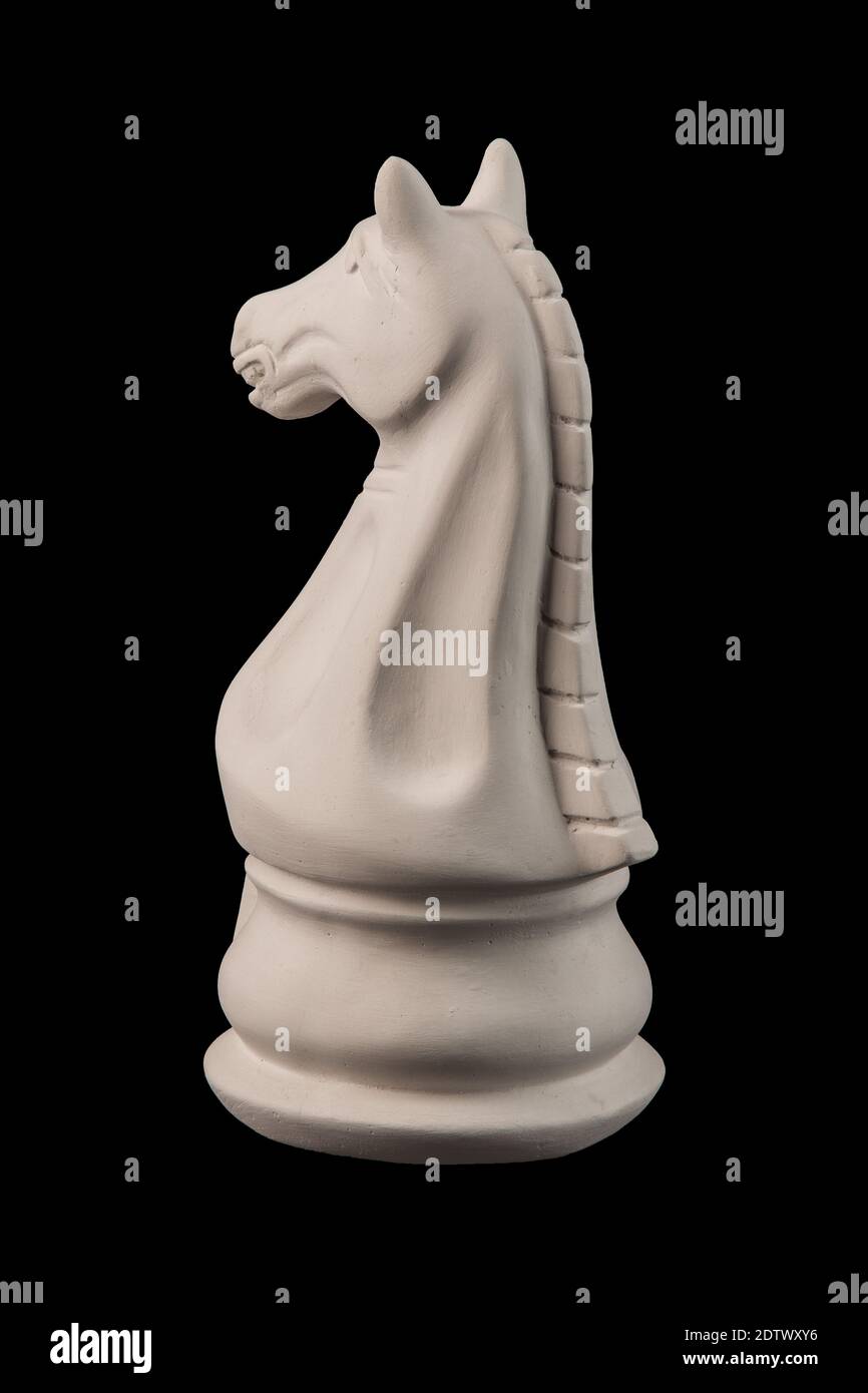 plaster figurine chess piece horse white background Stock Photo - Alamy