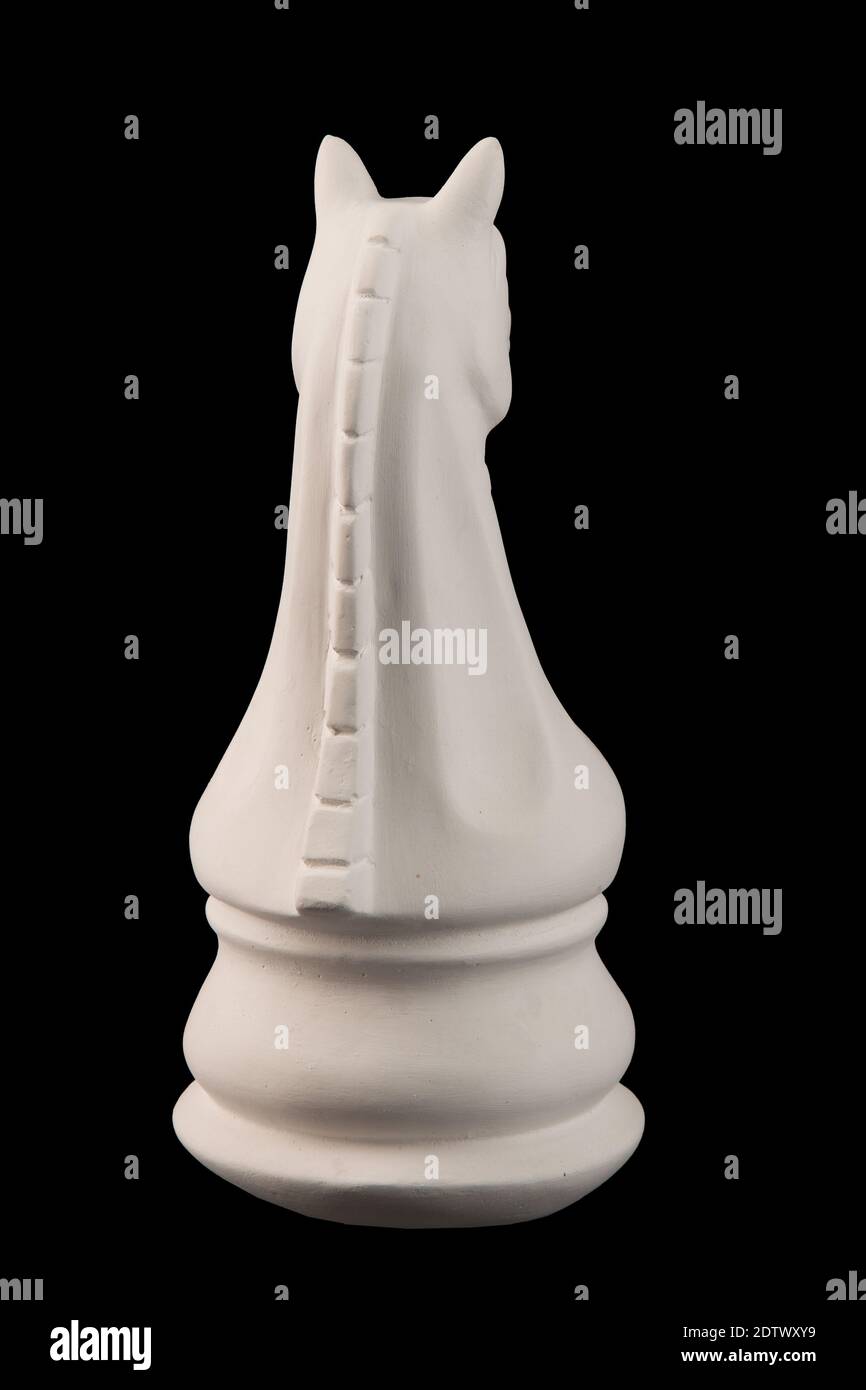 plaster figurine chess piece horse white background Stock Photo - Alamy