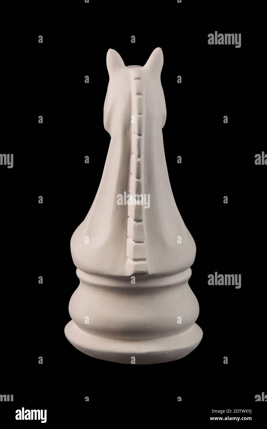 plaster figurine chess piece horse white background Stock Photo - Alamy