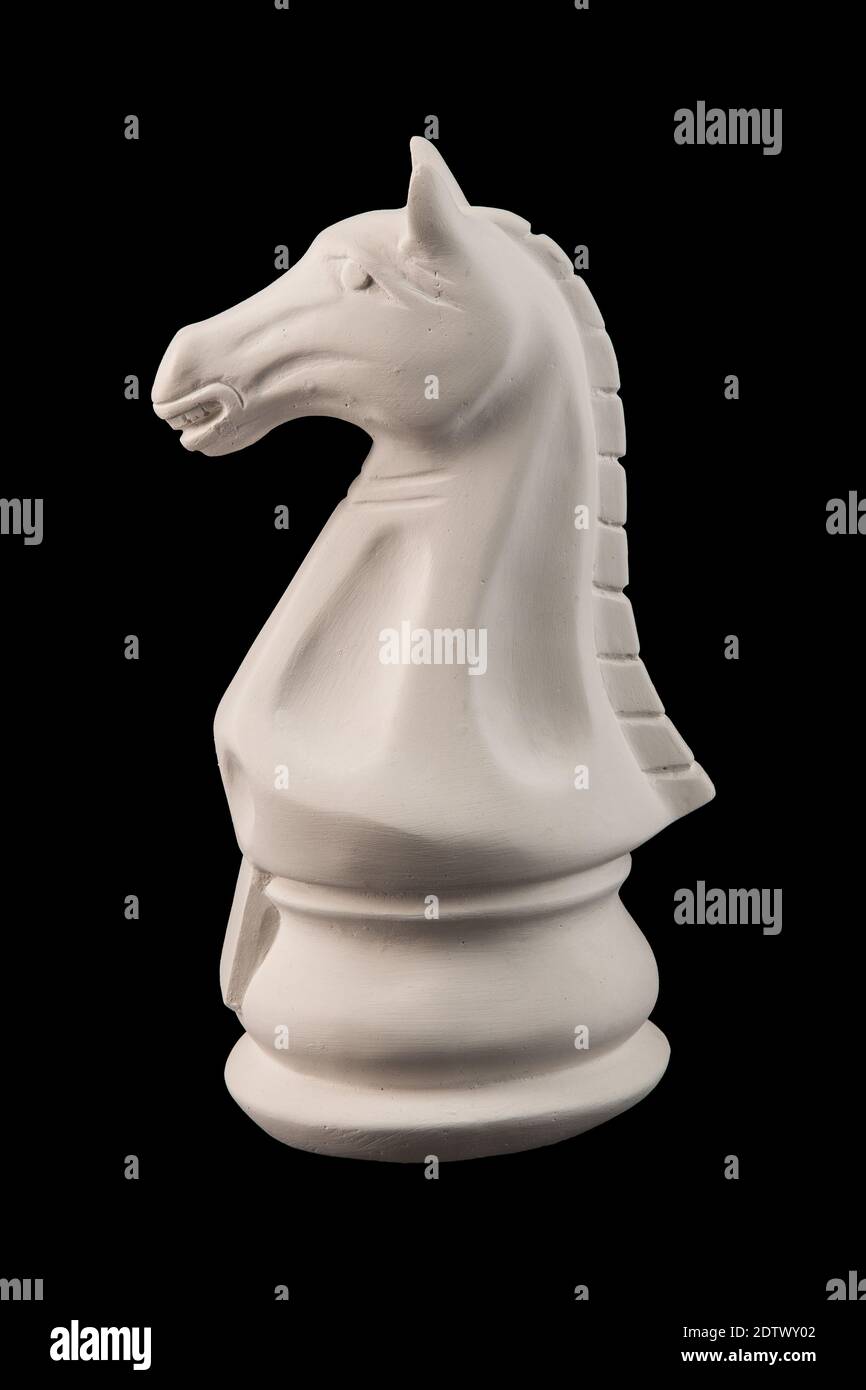 plaster figurine chess piece horse white background Stock Photo - Alamy