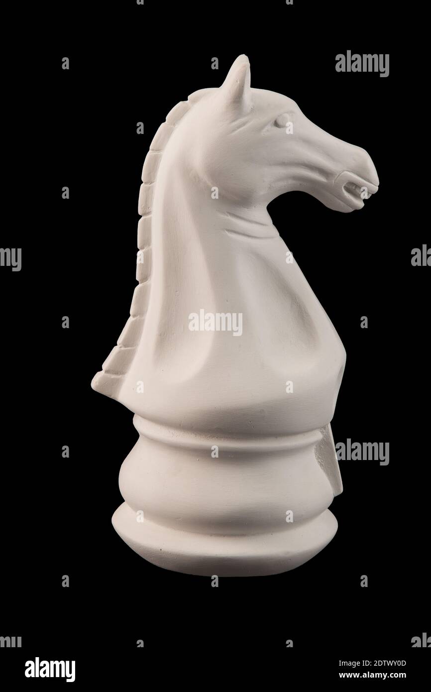 plaster figurine chess piece horse white background Stock Photo - Alamy