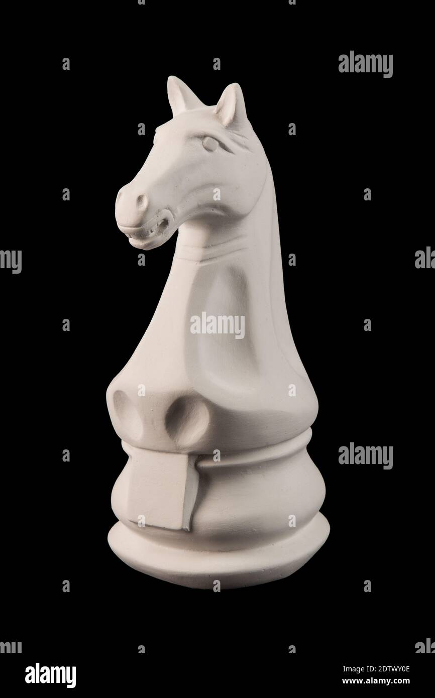 plaster figurine chess piece horse white background Stock Photo - Alamy